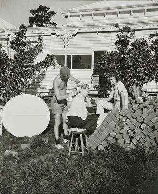 John Reed cutting Joy Hester's hair, watched by Sunday Reed - Heide